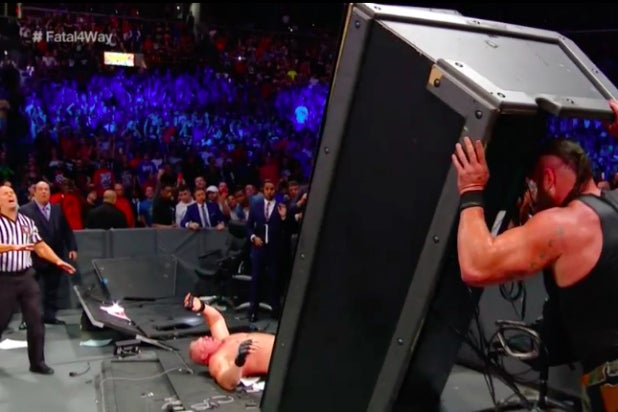 WWE 'SummerSlam': Watch Braun Strowman Dump an Announce Table on Brock ...